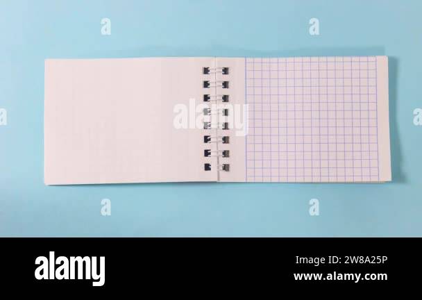 Stop motion animation. A notebook on springs with clean sheets in a ...