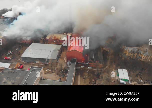 Massive large blaze fire in the city, aerial drone top view brick ...