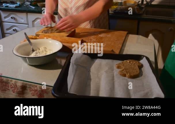 Woman is Pressing a Dough Into a Ram Shaped Form Cookie on a Baking ...