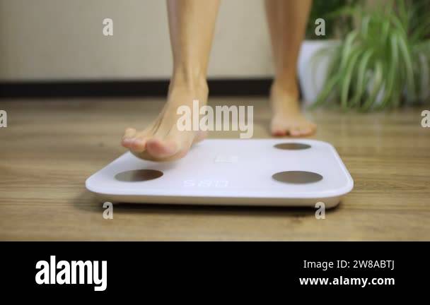 Step on the scale Stock Videos & Footage - HD and 4K Video Clips - Alamy