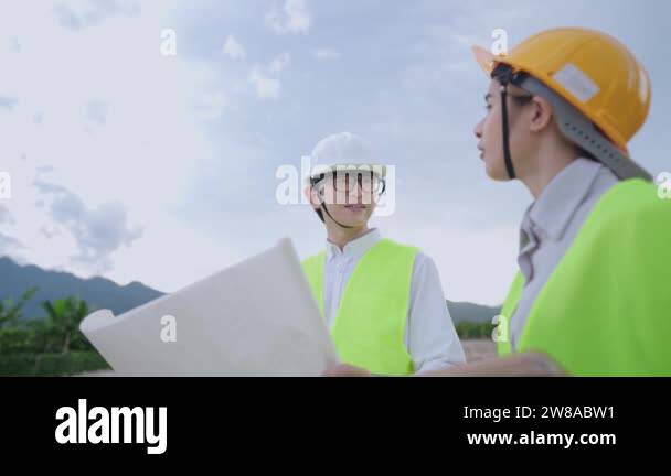 two civil engineer construction worker having conversation together on ...