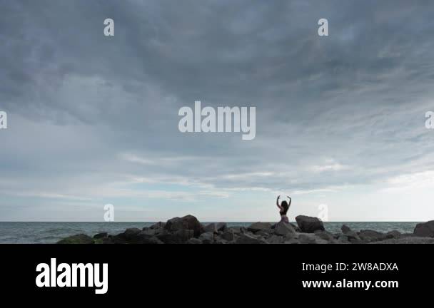 esoteric dance ocean harmony calm woman beach sky Stock Video Footage ...