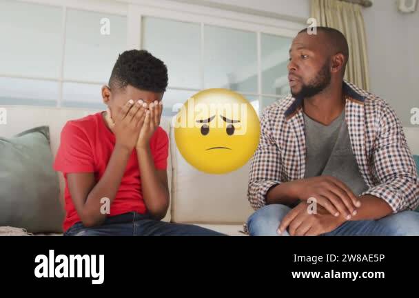 Animation of sad emoji icon over african american father talking with ...