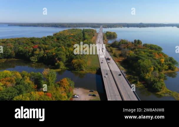 Traffic flowing smoothly on Canadian motorway, fall season colors. 4K ...
