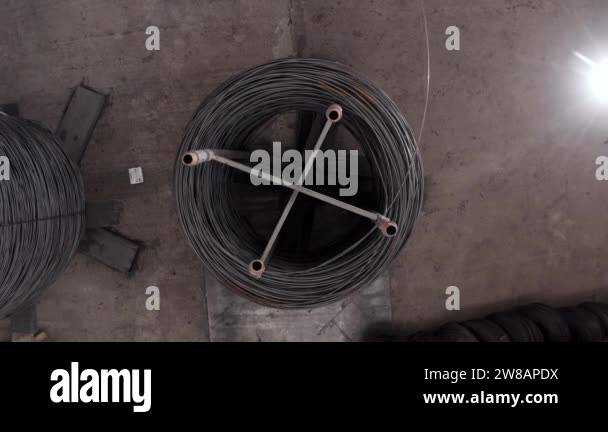 Steel reinforcement coils are wrapped using a special machine Stock ...