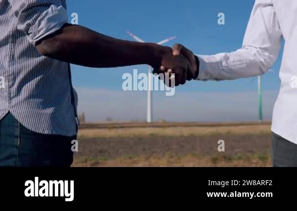 Two male African American electrical engineers stand against the ...