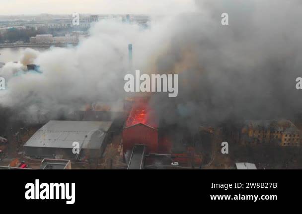 Massive large blaze fire in the city, aerial drone top view brick ...