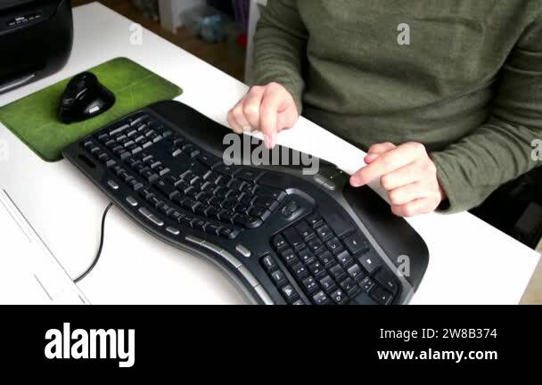 European man learns typing an email on keyboard shows learning the ten ...
