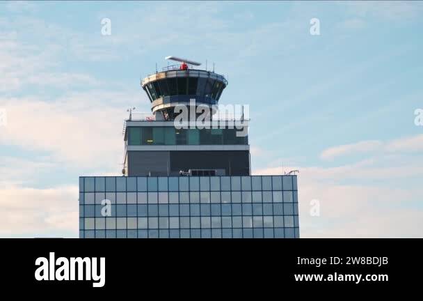 Functioning airport control tower with transparent booth. Air transport ...