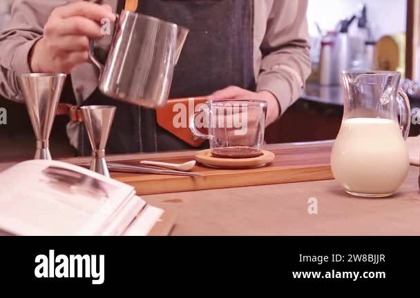 The Process of Pouring Milk Into Tea Stock Video Footage - Alamy