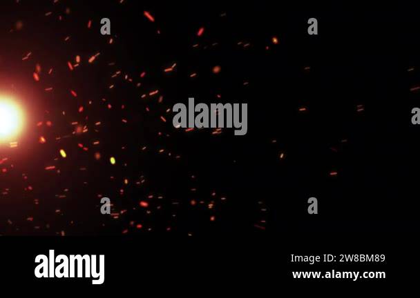 Animation of orange color flare light at the center left and fire particles movement on black ...