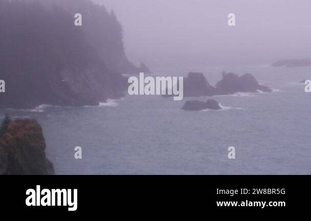 Juneau, Alaska - circa 2018: Aerial view of rocky coastline in fog and ...