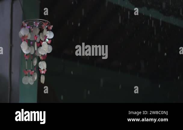 The Furin bell hangs on the corner of the house on a gloomy rainy day ...