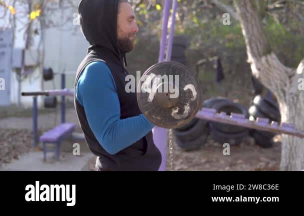 Strong Grey-Haired Man With Dreadlocks exercising His biceps Muscle ...