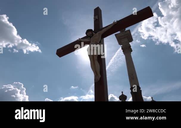 Wooden cross, figurine of crucified jesus christ on street in cloudy ...