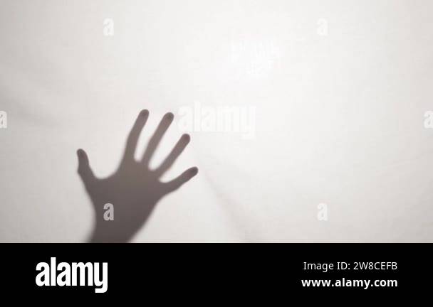 Hand behind sheet Stock Videos & Footage - HD and 4K Video Clips - Alamy