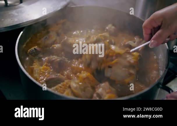 cooking. stew. buffet restaurant kitchen. Close-up. food is steaming ...