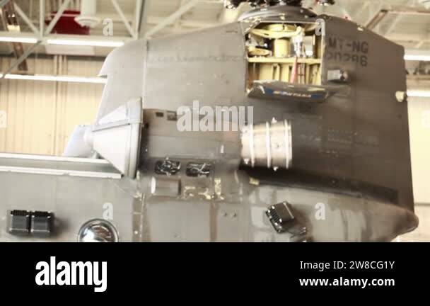 tail end of a CH-47 Chinook Helicopter leaving a hangar Stock Video ...