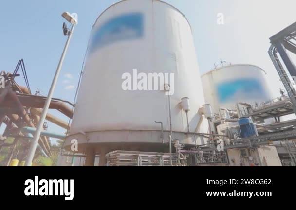 Large storage tanks in the factory. Exterior of a modern factory. White ...