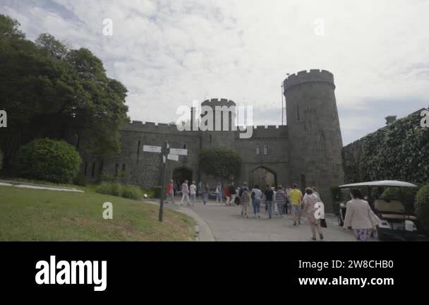 Beautiful ancient fortress with the observation tower on summer cloudy ...