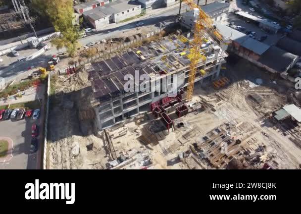 Construction site background. Hoisting cranes and new multi-storey ...