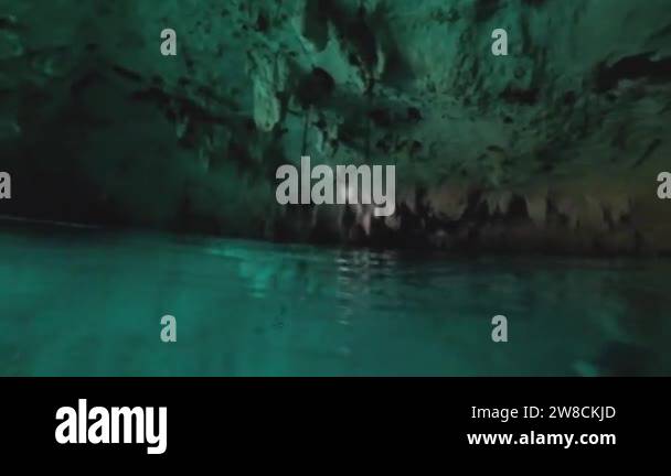 Diving up in stalactite cave in the 'Gran Cenote' natural limestone ...