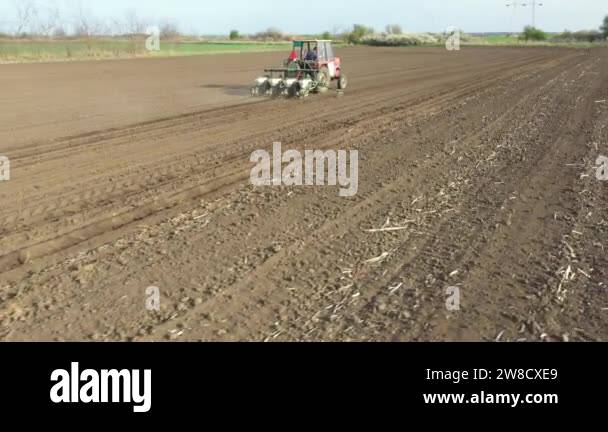 Above rotation view, orbit dolly move, of tractor as pulling mechanical ...