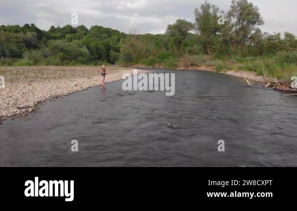 Cinematic footage without post processing (original file, no post production). A young beautiful ...