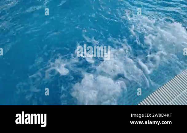 Water drop in swimming pool. Blue color. Stop motion video. H2O hotel ...