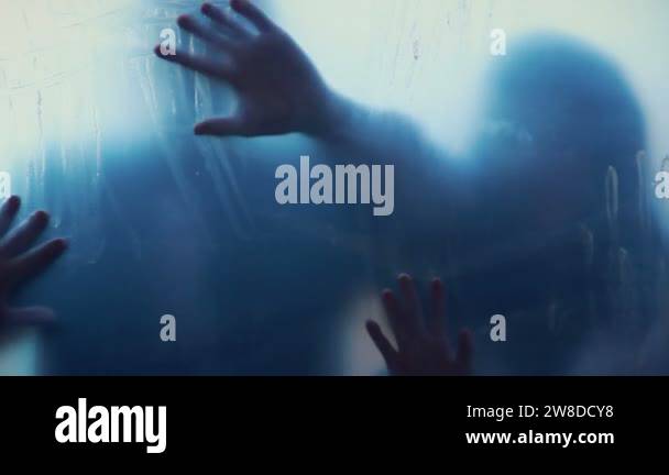 Souls of dead people smearing blood on transparent surface, scary ...