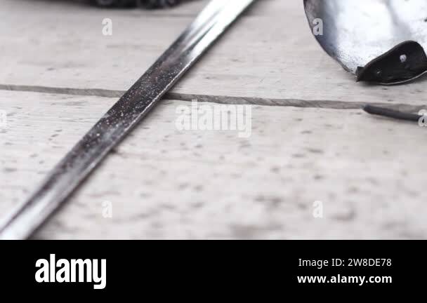 Sharp blade of steel sword and helmet with mail face mask, weapon ...