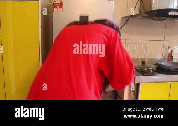 Muslim Lady Taking Bags Of Fruits From Fridge - Back View Stock Video ...