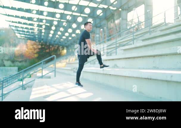 young asian runner athlete with muscle pain. Man massaging Stretching ...