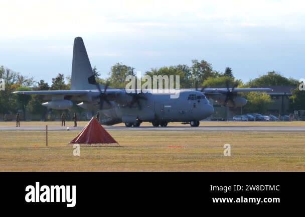 Lockheed Martin C-130J military aircraft standing on runway Stock Video ...