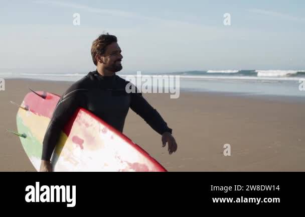 Happy surfer holding surfboard Stock Videos & Footage - HD and 4K Video ...