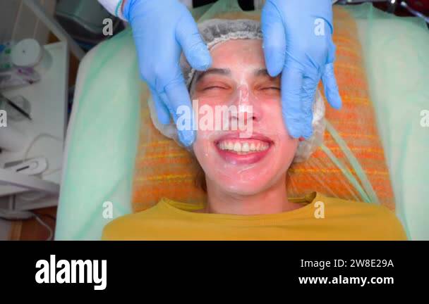 Beauty clinic concept. Young woman getting professional facial ...