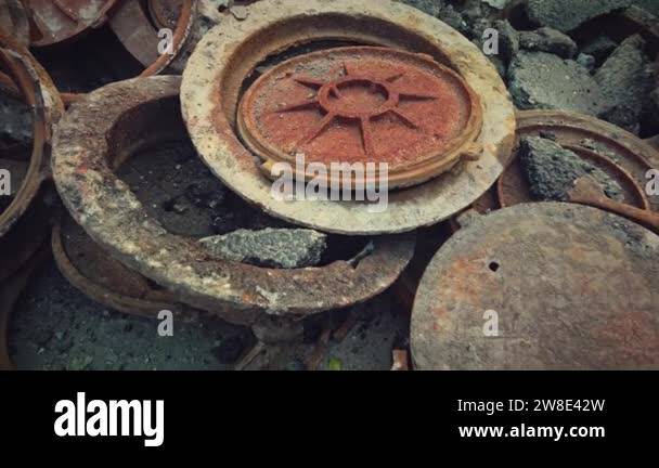 Many rusty sewer manhole cover lids on the ground after the renovation ...