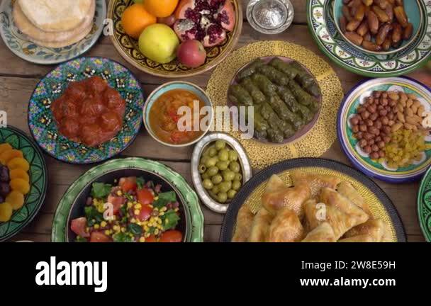 Festive Muslim table top view. Traditional Halal meals of sacrificial ...