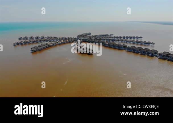 Unique Palm Tree Design Of Overwater Huts On The Beach In Southeast ...