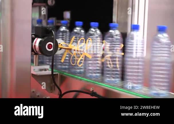 Clear plastic Bottles transfer on Automated conveyor systems industrial ...