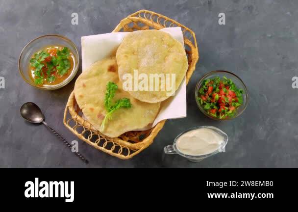 Homemade corn flatbread female hand cilantro greens tomato salsa ...