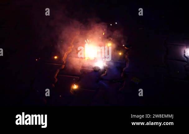 Spark shower fireworks or firecrackers in home driveway at night ...