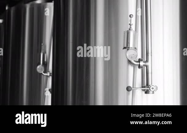 Private microbrewery. Modern beer plant with brewering kettles, tubes ...
