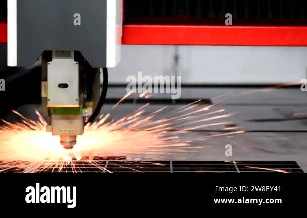 Laser cut head machine while cutting the sheet metal with the sparking ...