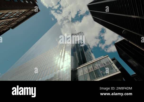 Rotation bottom view of skyscrapers with sky background. Cityscape view ...