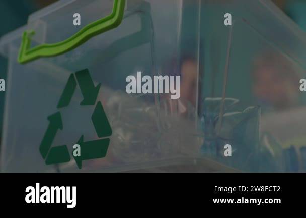 Plastic container with green recycle sign and falling plastic bottles ...