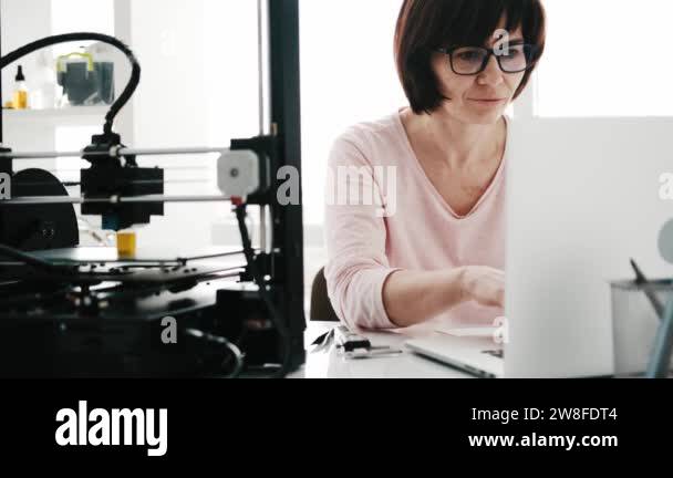 Woman printer Stock Videos & Footage - HD and 4K Video Clips - Alamy