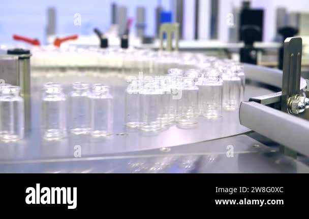 Clear Glass bottles transfer on Automated conveyor systems industrial ...