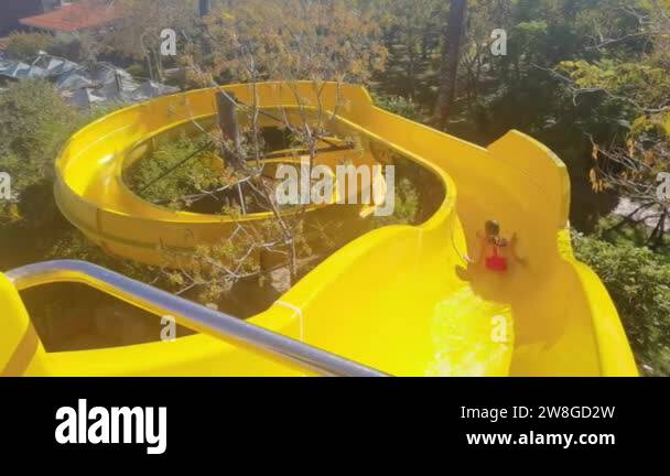 Girl Having Fun On Water Slides Aqua Park Glides. Funny Ride On Water ...