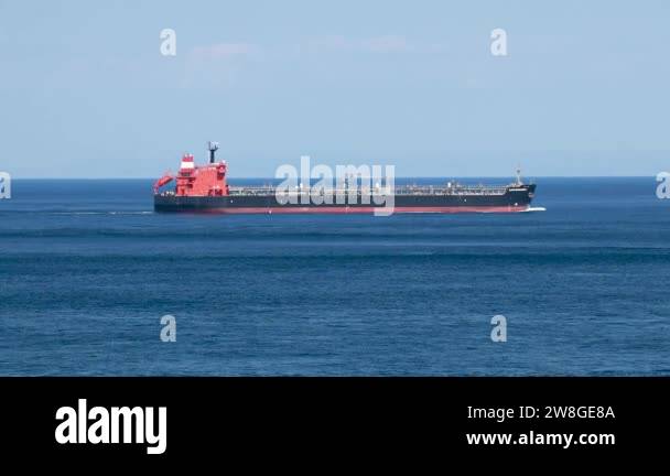 Close up of empty super tanker ship with the deck crane, sailing in ...
